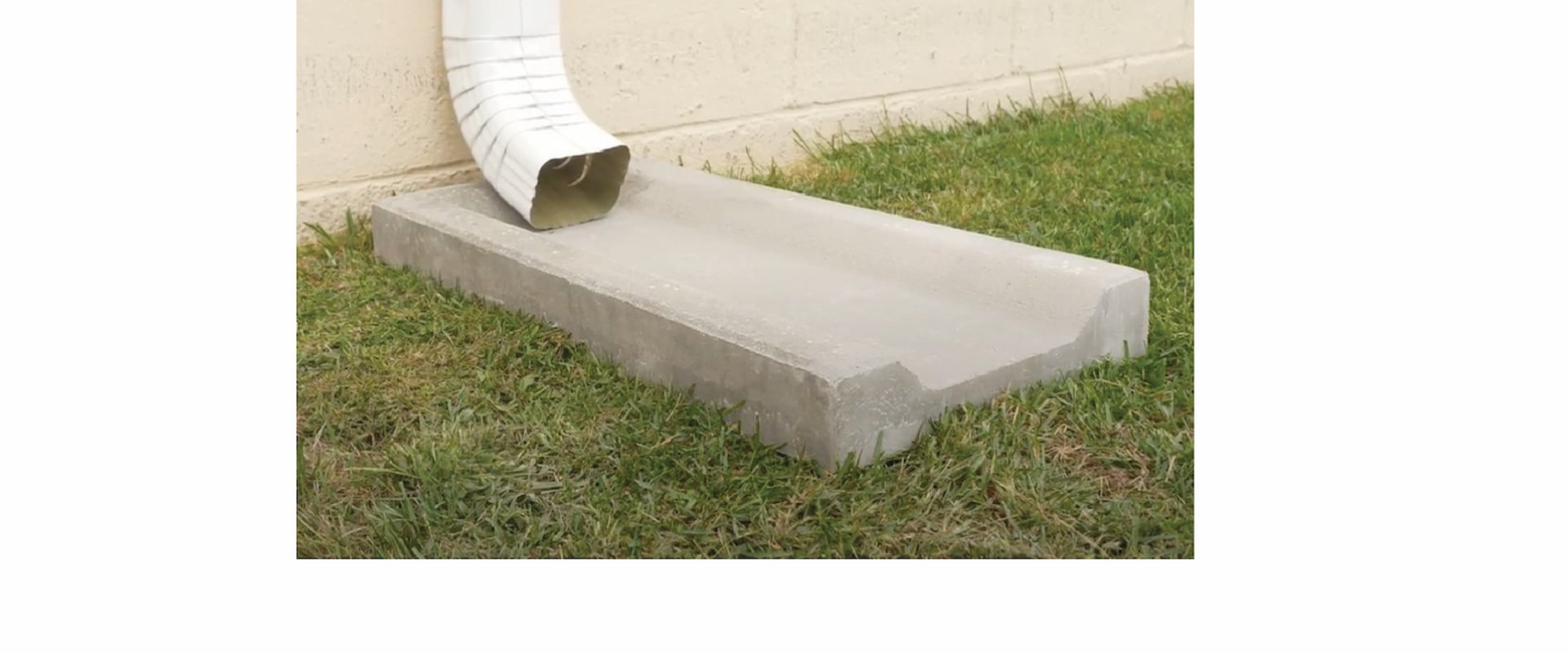 What are splash blocks at the end of downspouts?